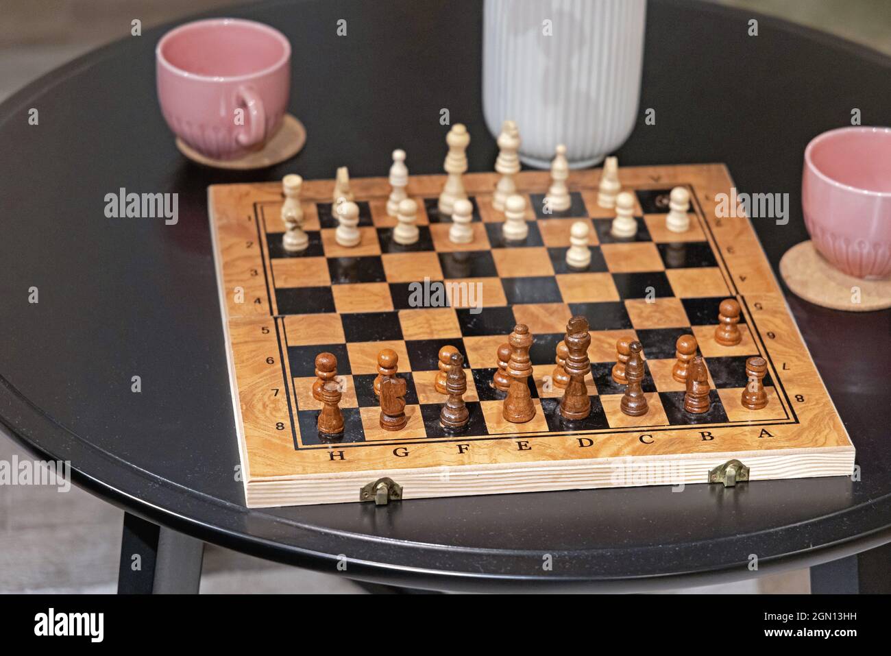 Wooden Chess Board at Coffee Table in Home Stock Photo - Alamy