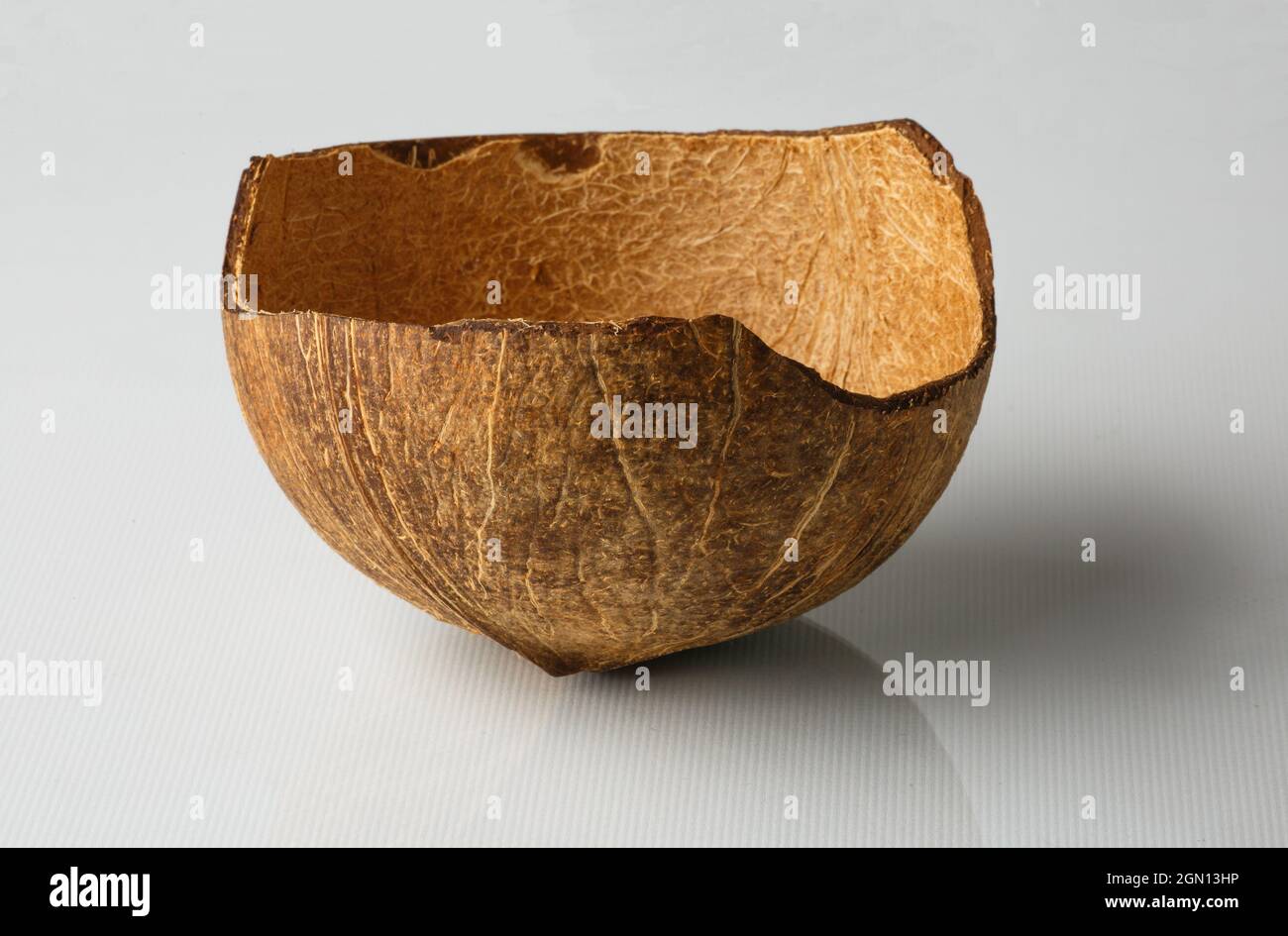 Coconut shell isolated on white background. The coconut flakes are ...