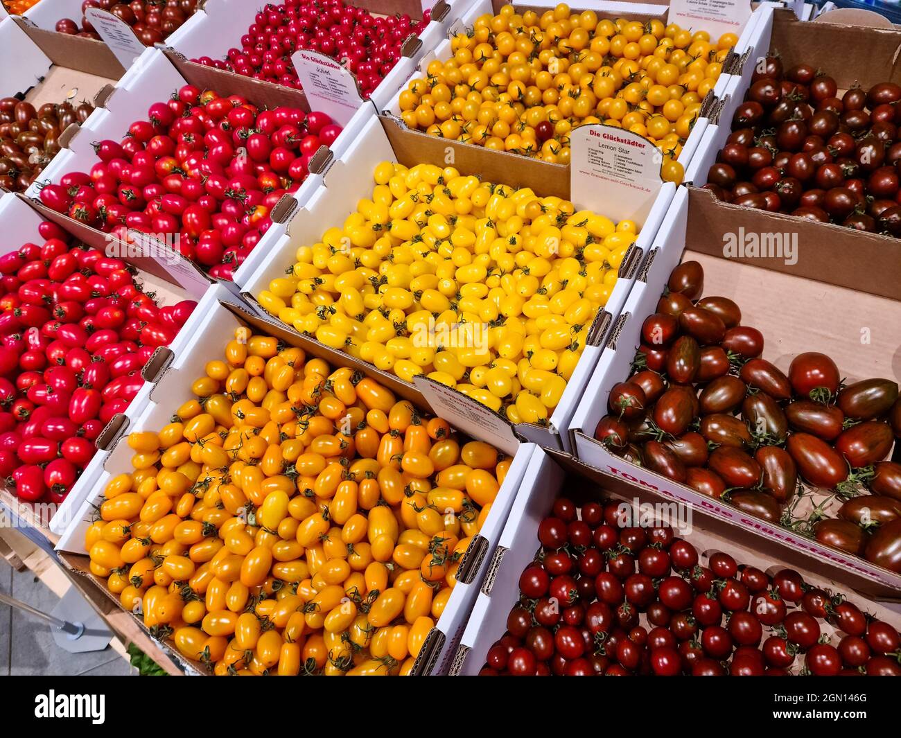KIEL, GERMANY - Aug 30, 2021: Different types of tomatoes in boxes in a ...