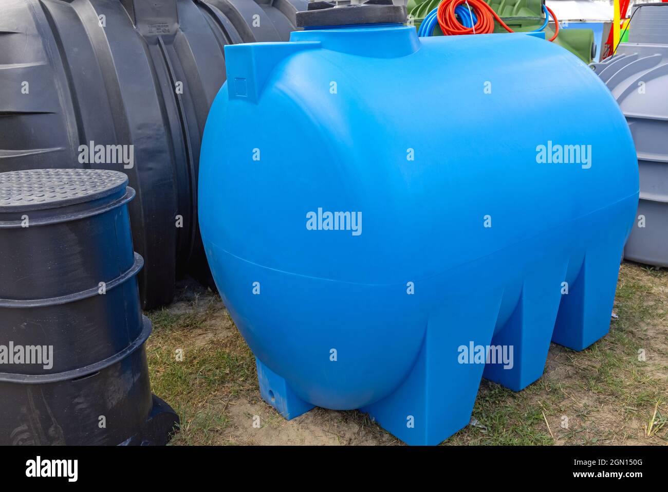 Big Blue New Plastic Water Tank Reservoir Stock Photo - Alamy