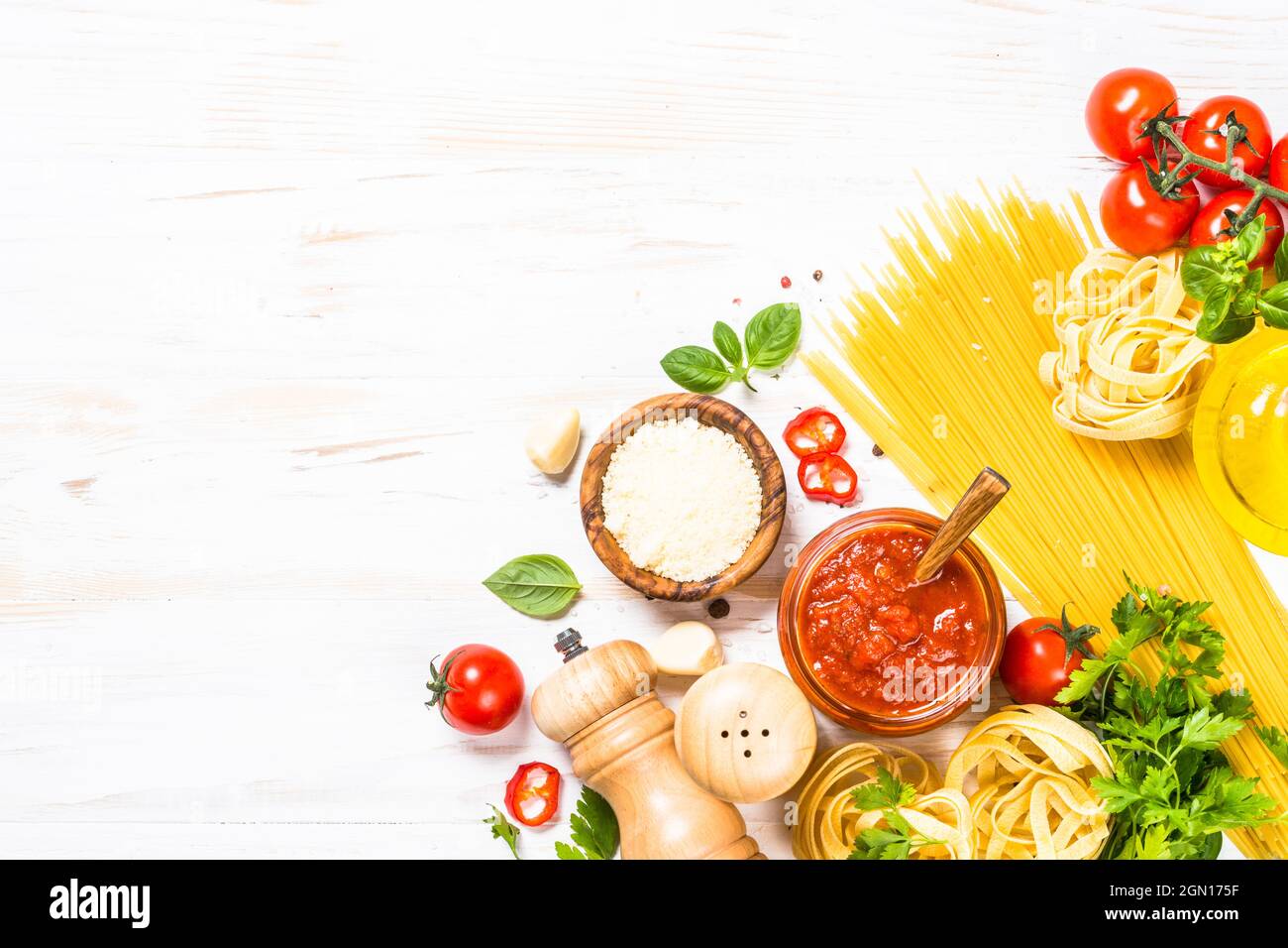 Italian food background at white bkitchen table Stock Photo - Alamy