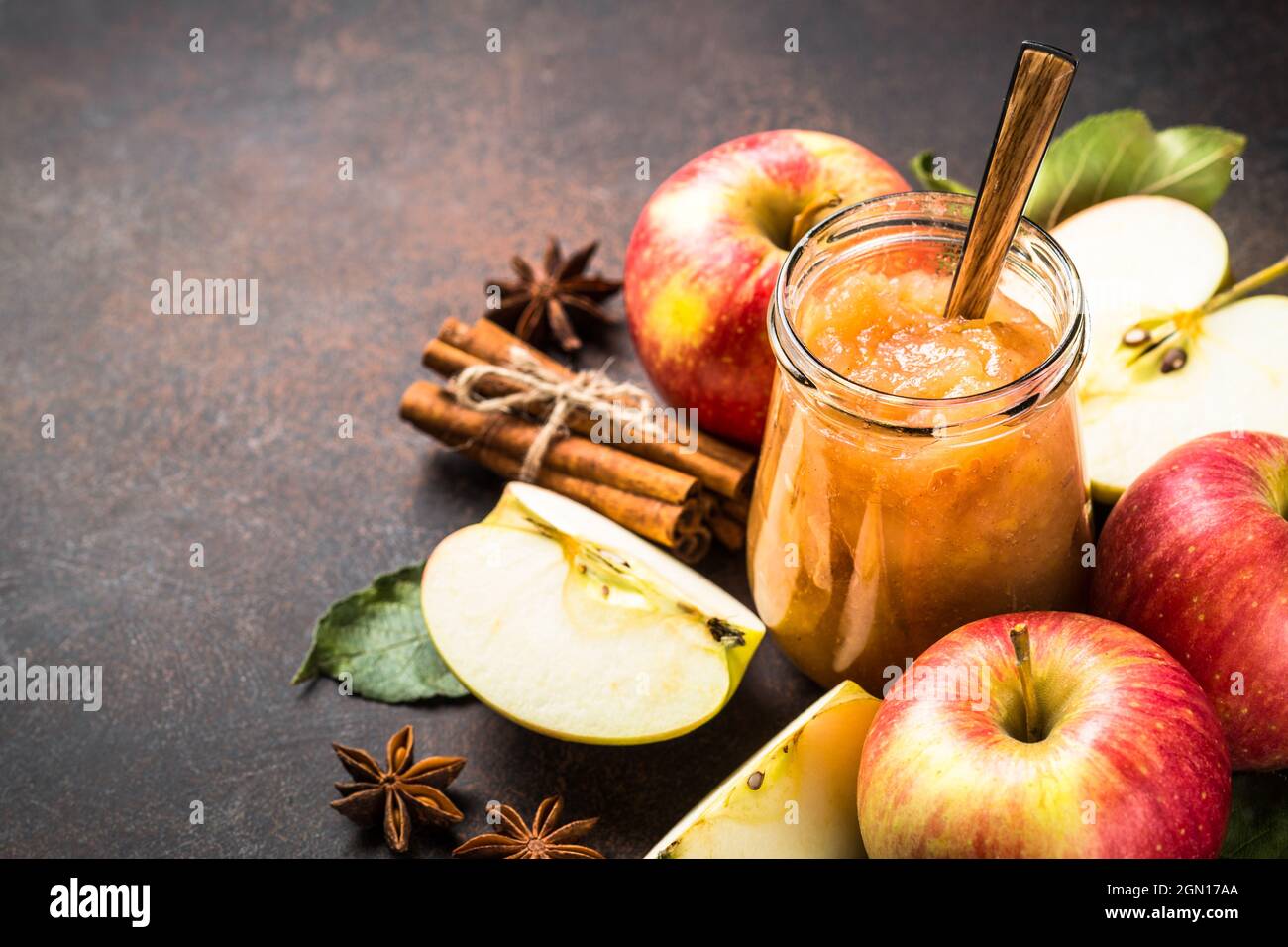 Apple jam with spices and fresh apples on dark background Stock Photo - Alamy