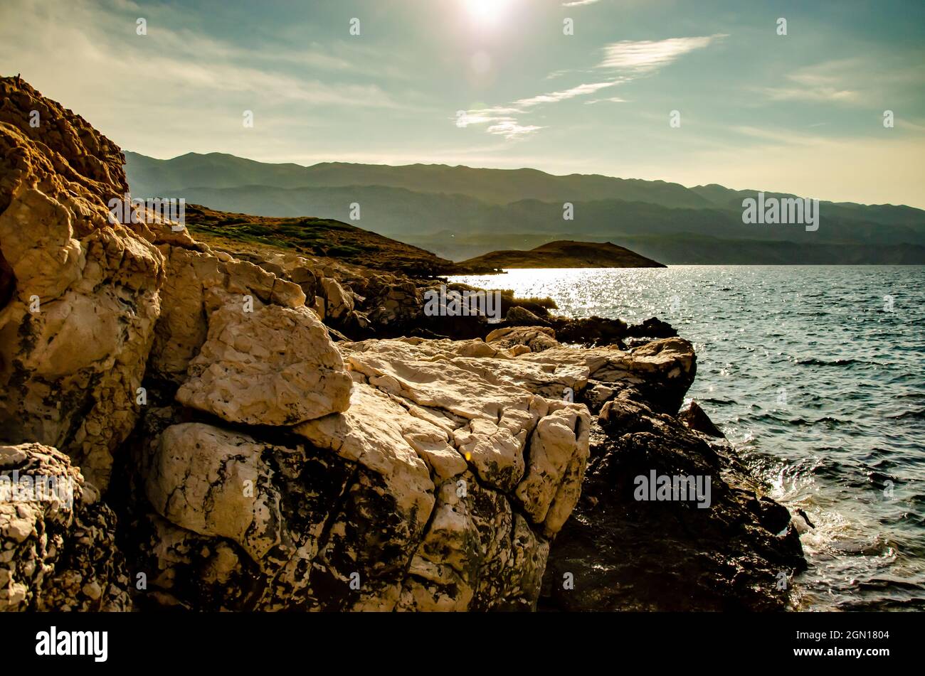 Scenic shot of stones in the shore working as breakwaters in a sea ...