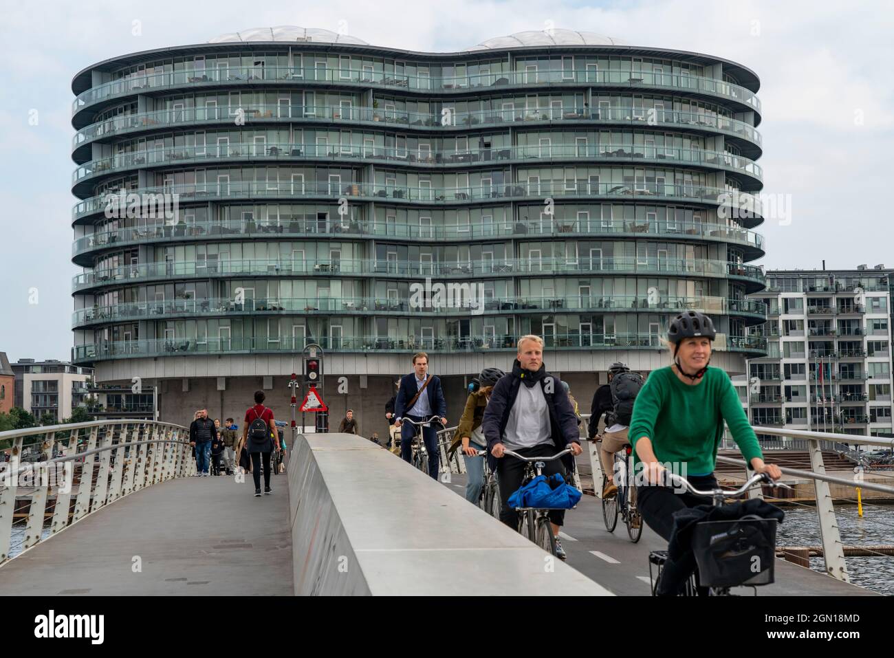 Cyclists on the Bryggebroen cycle and footpath bridge over the harbour ...