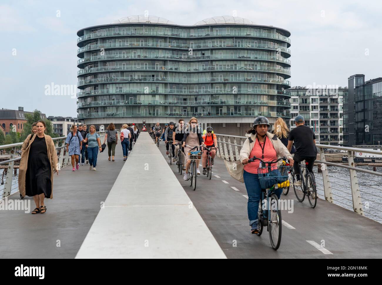 Cyclists on the Bryggebroen cycle and footpath bridge over the harbour ...