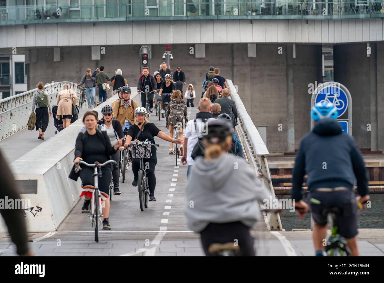 Cyclists on the Bryggebroen cycle and footpath bridge over the harbour ...