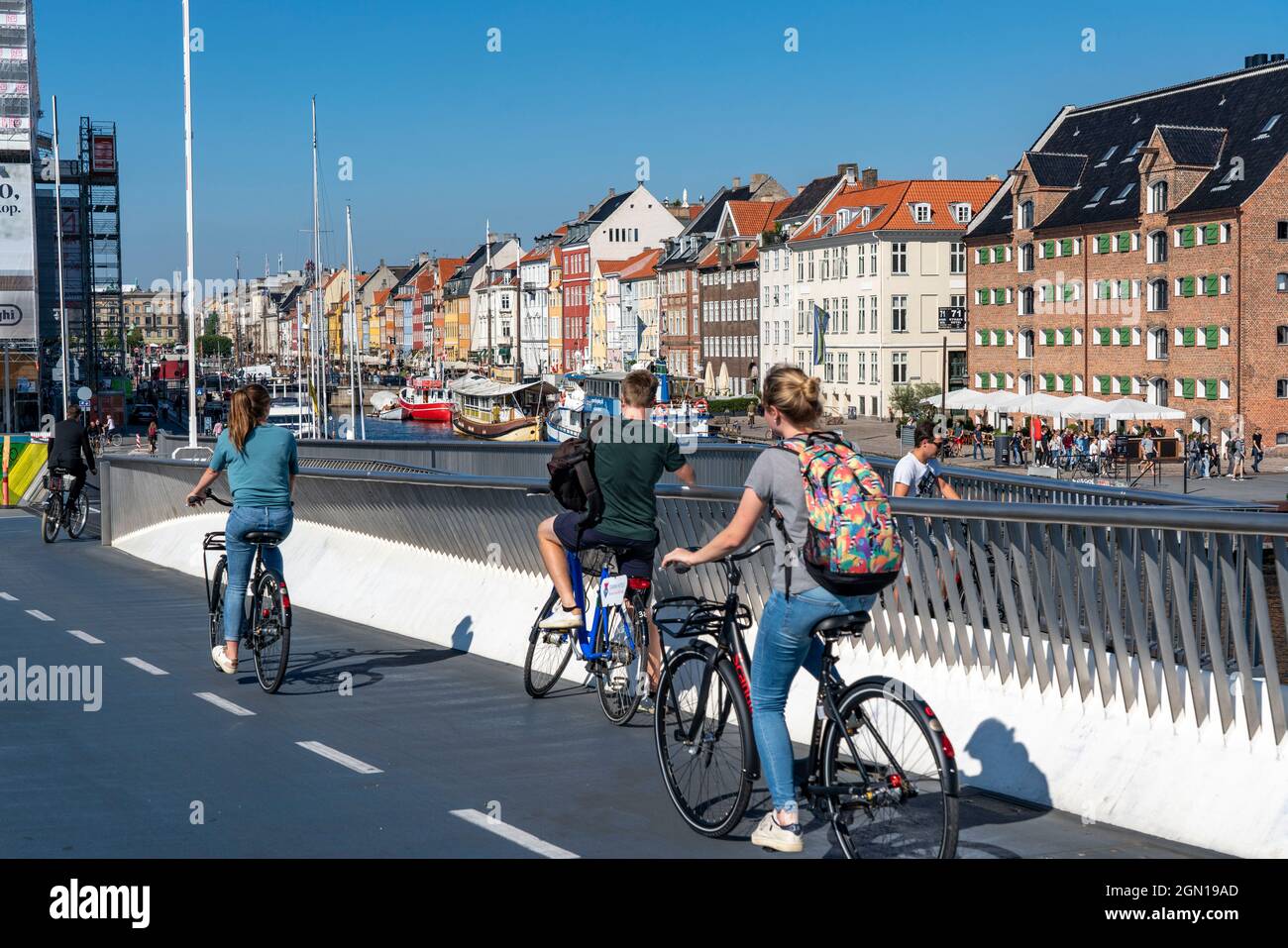 Cyclists on the Inderhavnsbroen cycle and footbridge, over the harbour ...