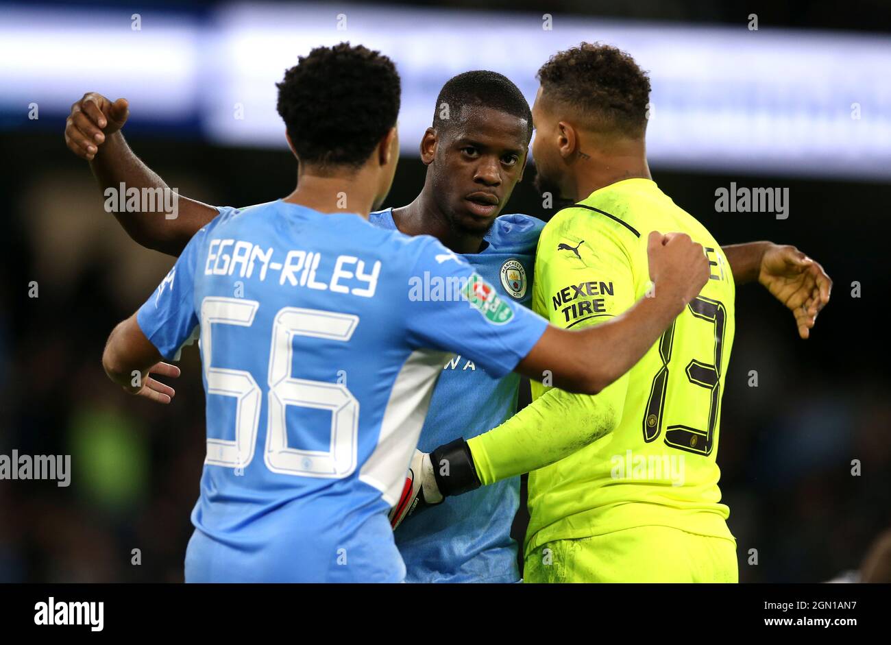 Manchester City's Luke Mbete-Tabu (centre) celebrates with CJ Egan ...