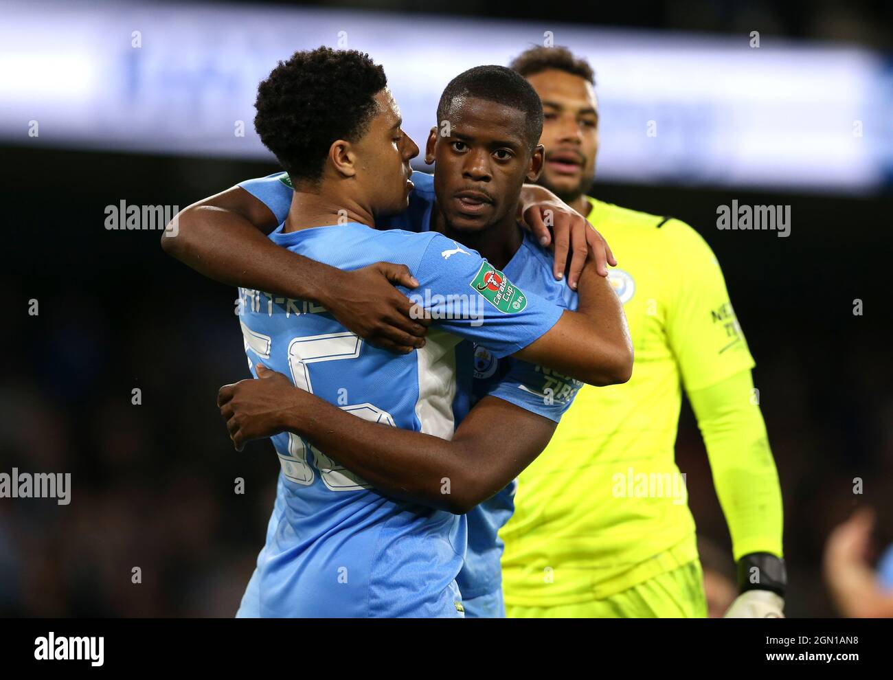 Manchester City's Luke Mbete-Tabu (centre) celebrates with CJ Egan ...