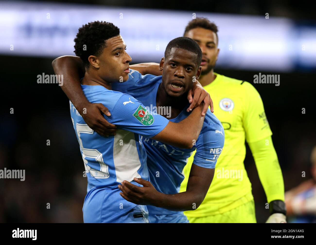 Manchester City's Luke Mbete-Tabu (centre) celebrates with CJ Egan ...