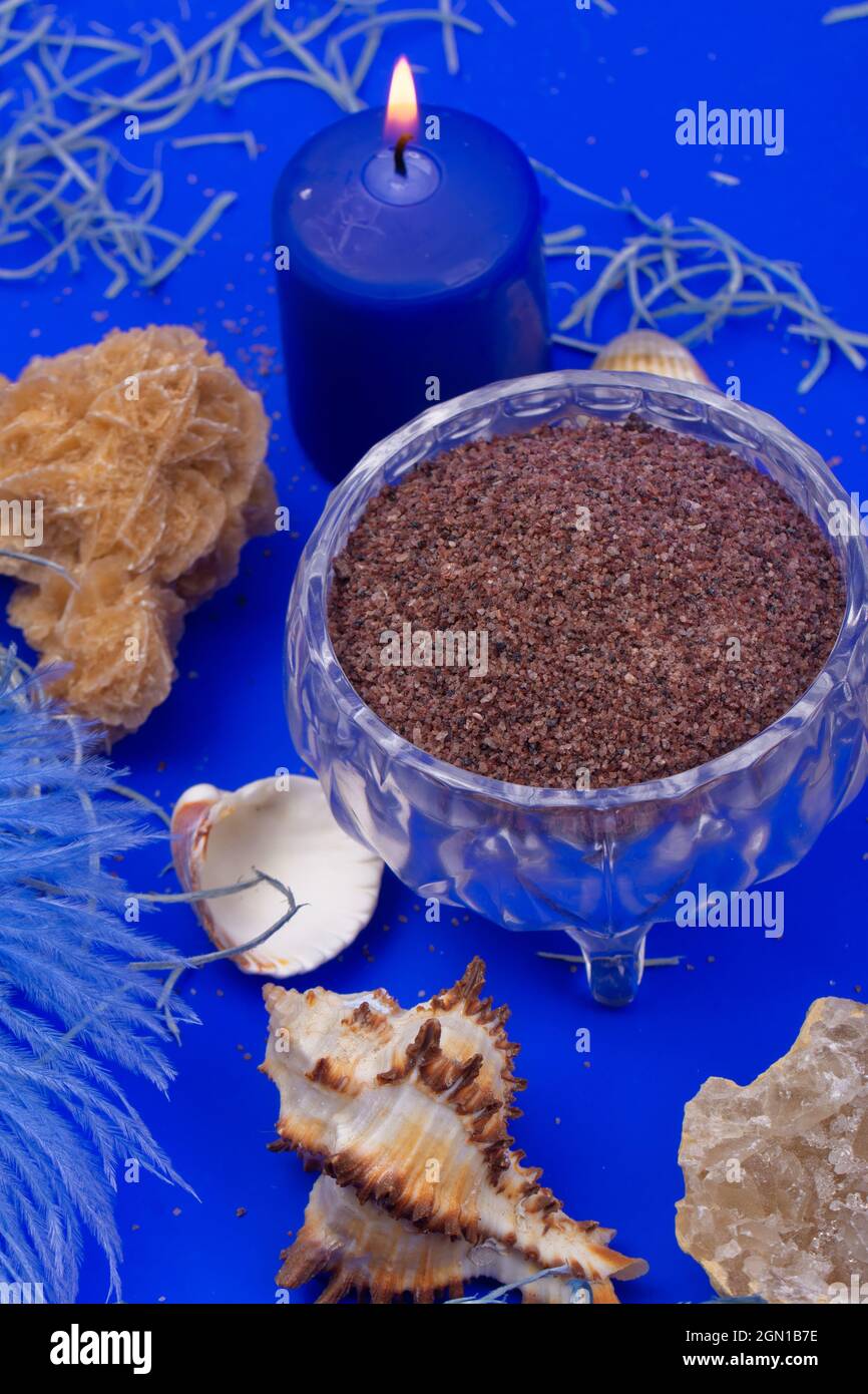 Spa products with sea shells and salt on blue background. Beauty ...
