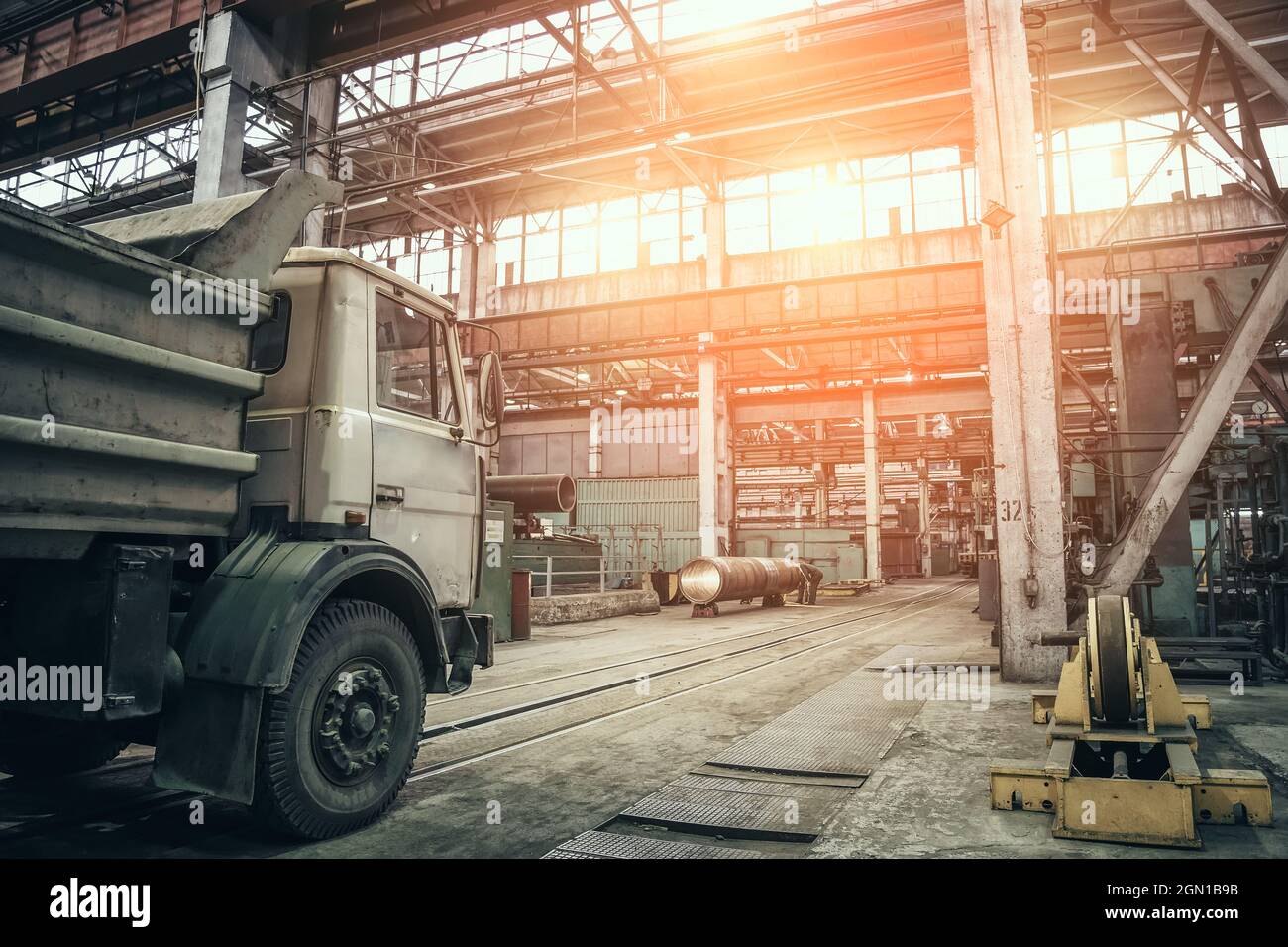 Big cargo freight truck inside metallurgical factory workshop interior ...