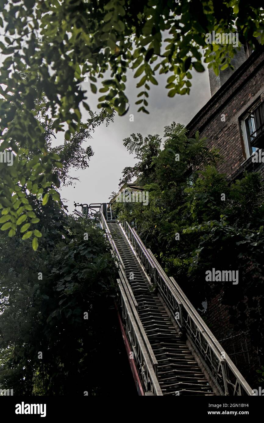 Fire in a residential five-story building. Fire escape with a basket to ...