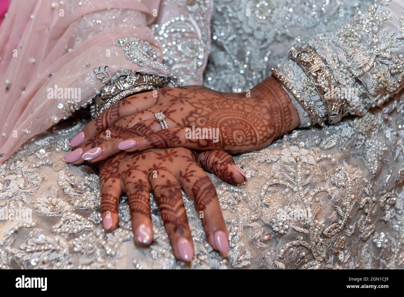 Beautiful Hands With Mehndi And Bangles And Nail Polish