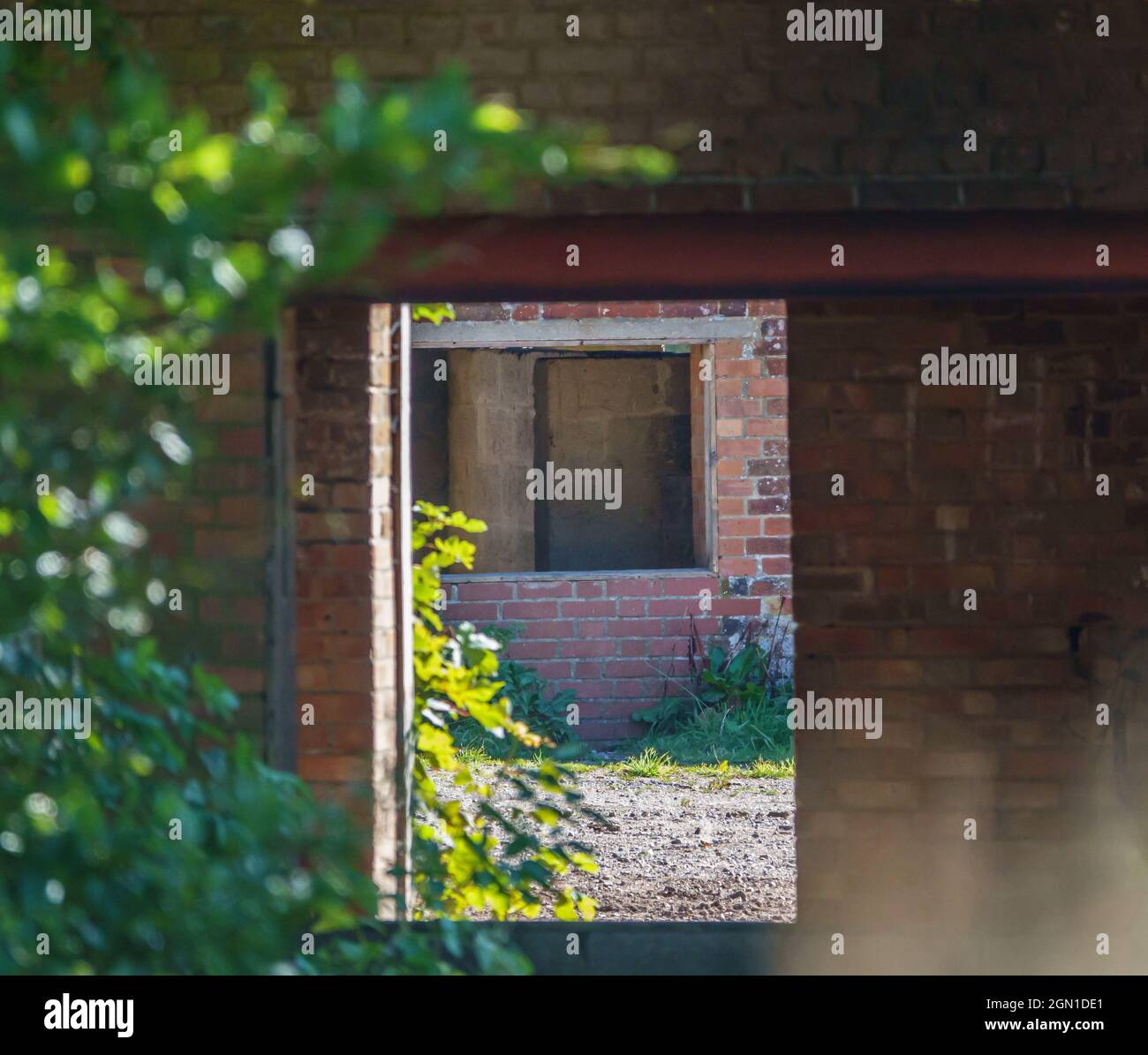 a view through a doorless doorway, through a windowless window to a far ...