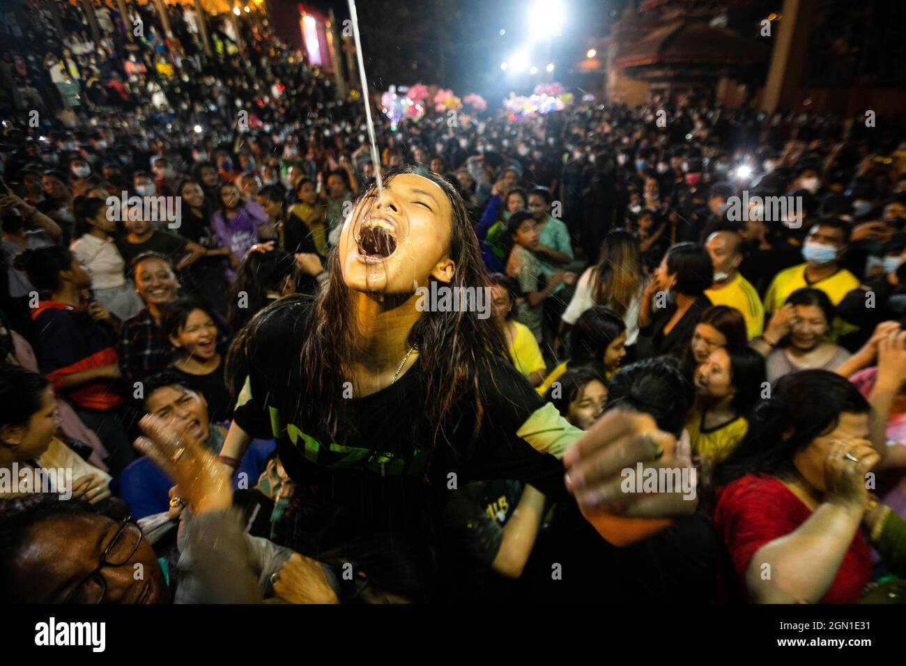 Kathmandu, Nepal. 21st Sep, 2021. Nepalese women struggle to drink ...
