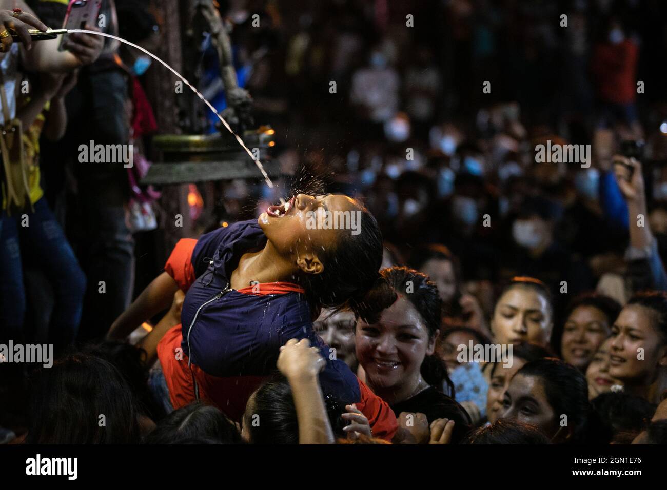 Kathmandu, Nepal. 21st Sep, 2021. Nepalese women struggle to drink ...