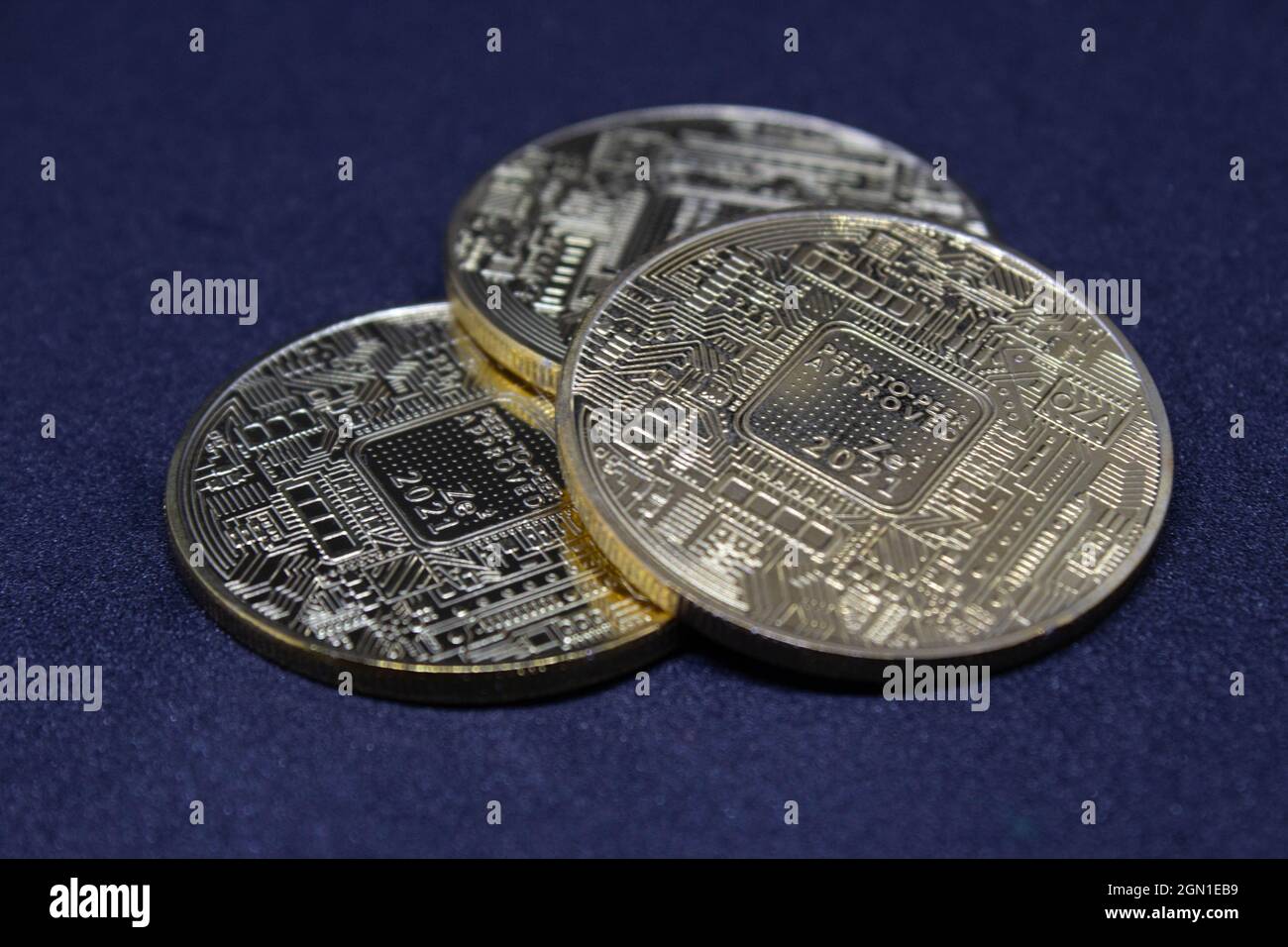 Bitcoins on different colored surfaces. Bitcoin is the most valuable ...