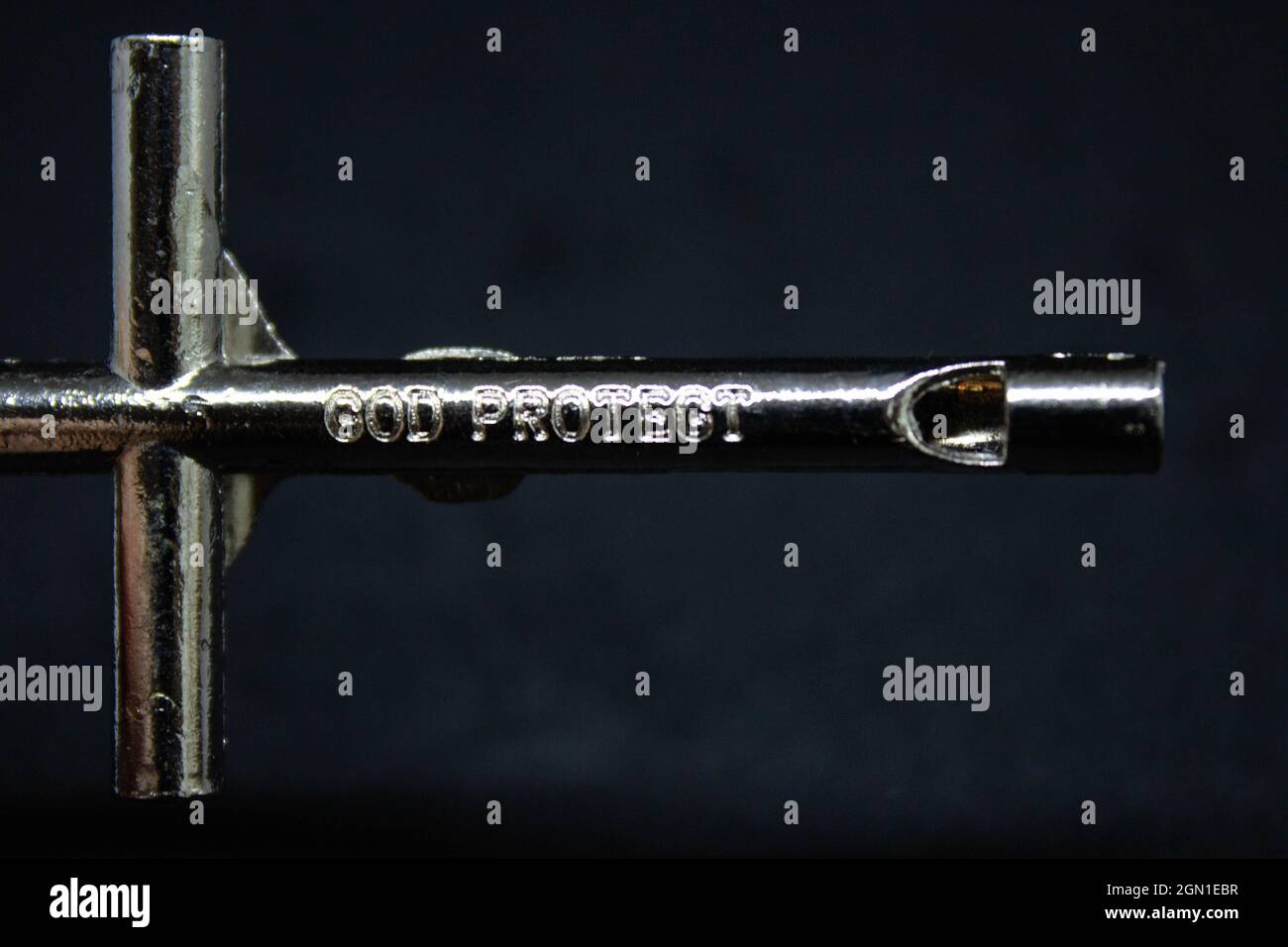 Silver cross. God protect written on it. Jesus served his life to save ...