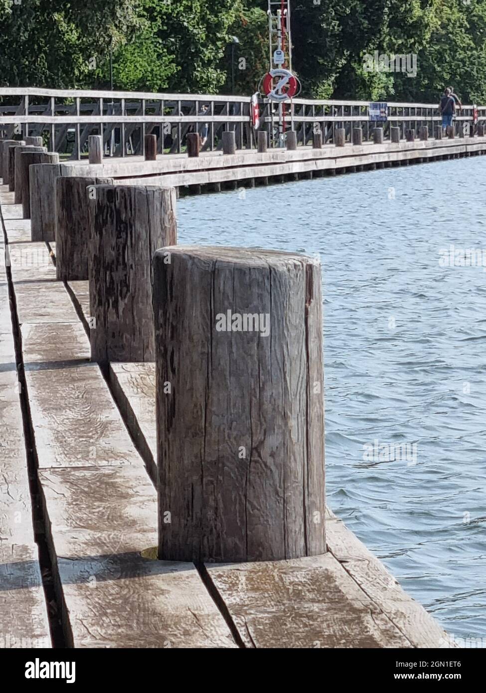 Wooden pedestrian bridge over the river Stock Photo - Alamy