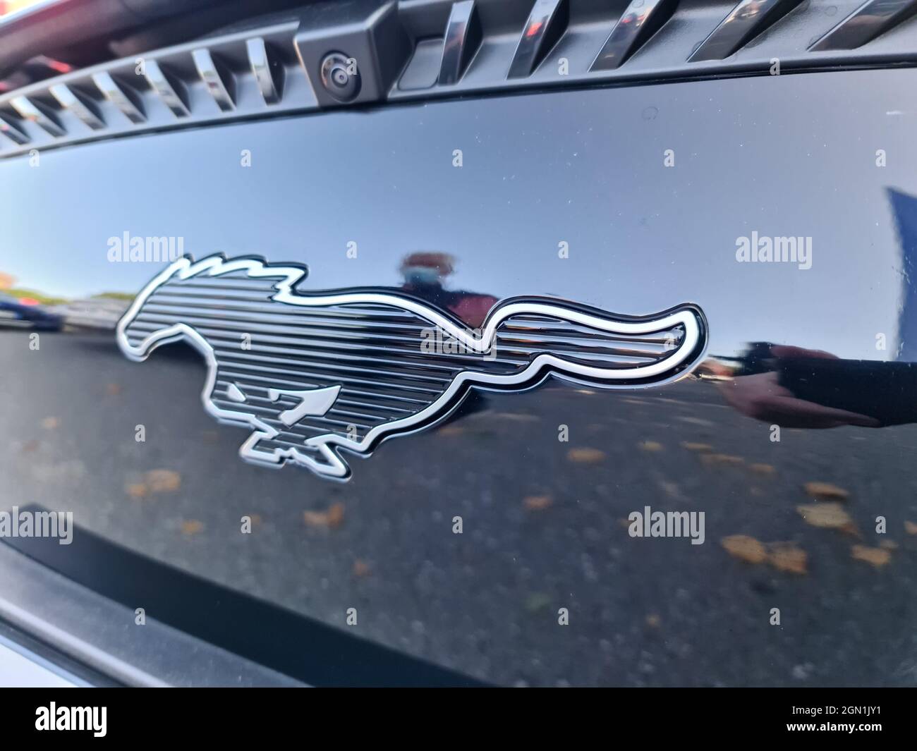 KIEL, GERMANY - Sep 03, 2021: The front logo of a Ford Mustang Mach-E ...