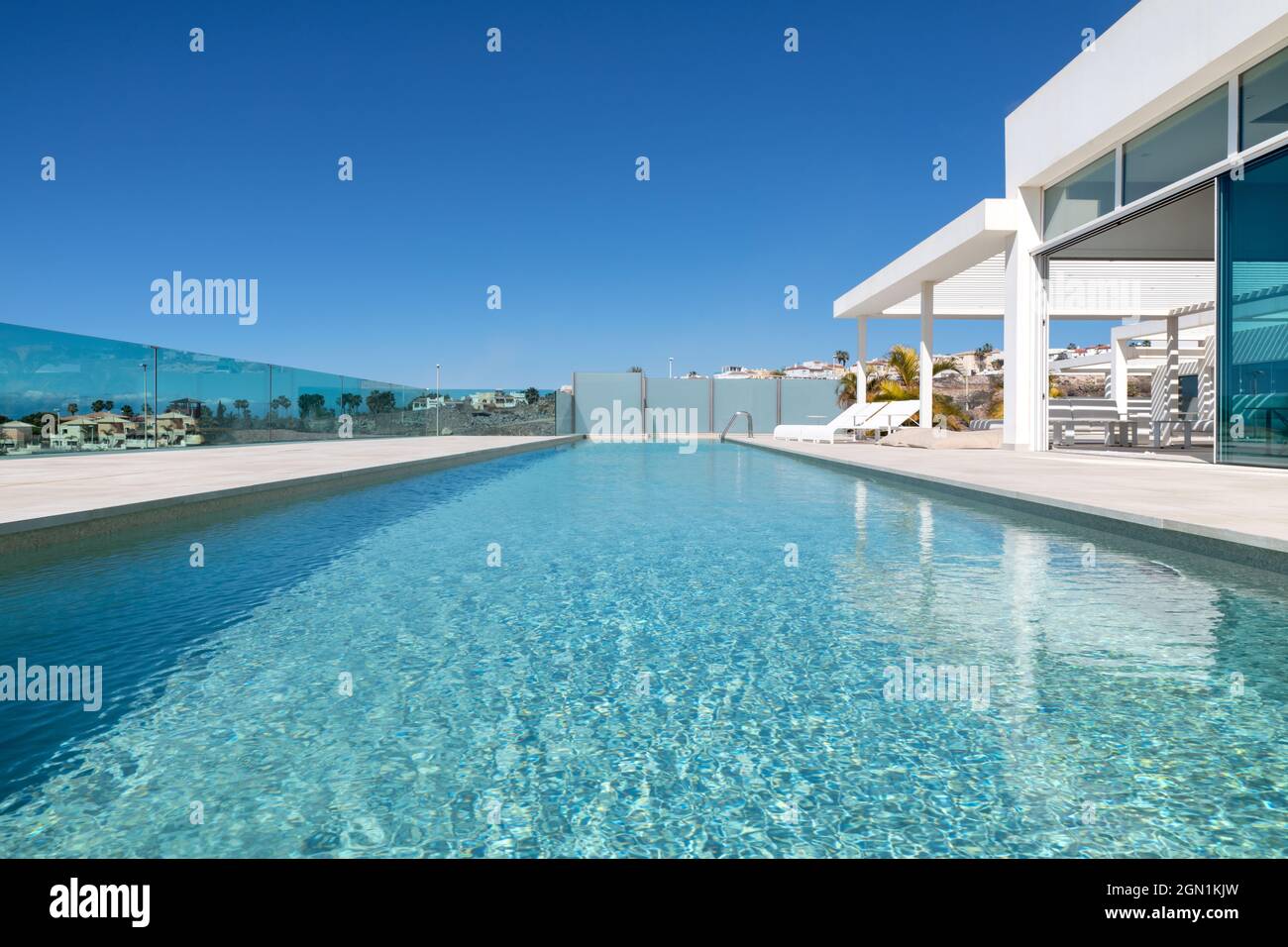 Luxurious property with an infinity swimming pool surrounded by a ...