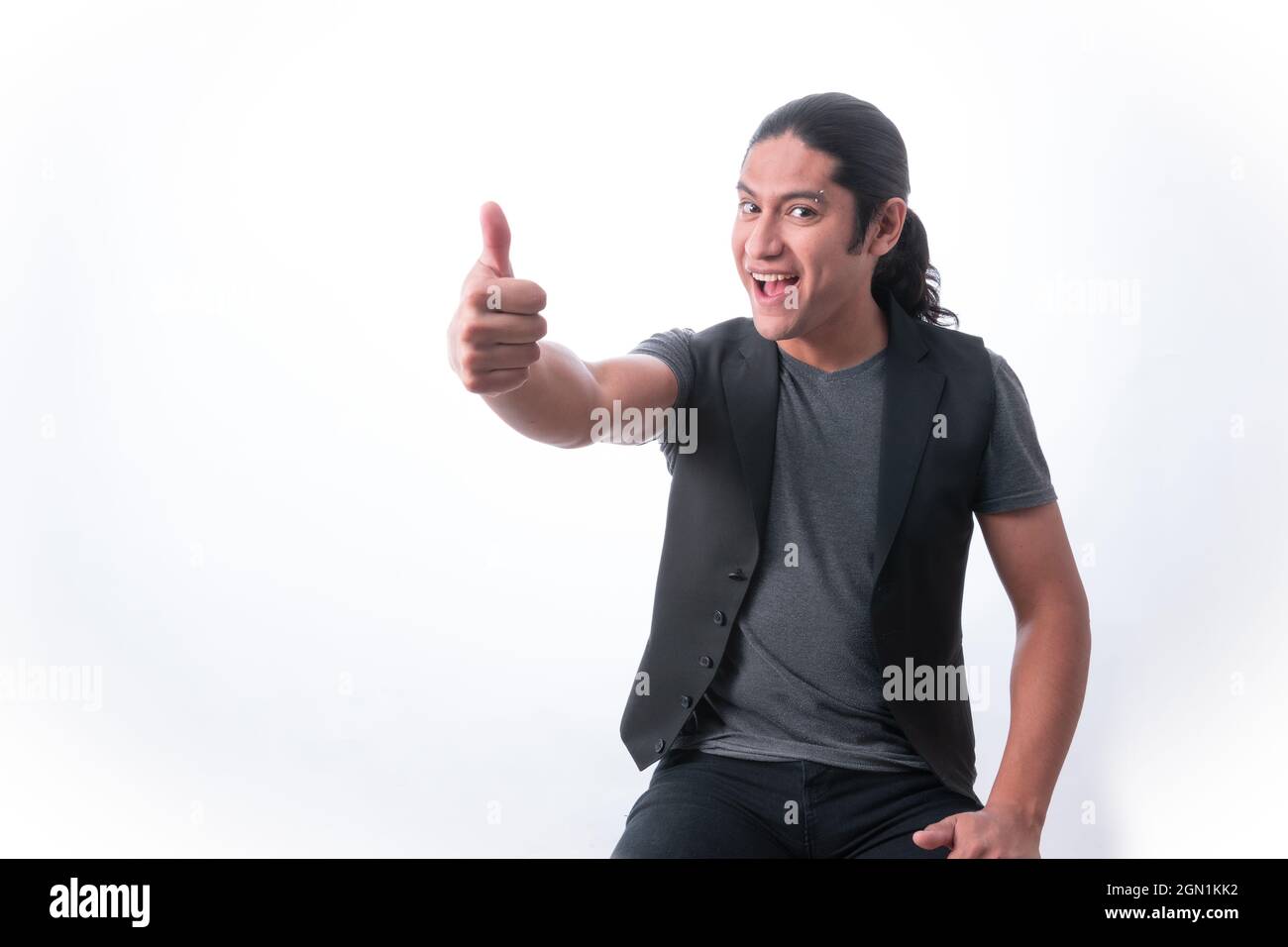 Person with white background, man gesturing, he points his thumb up in ...