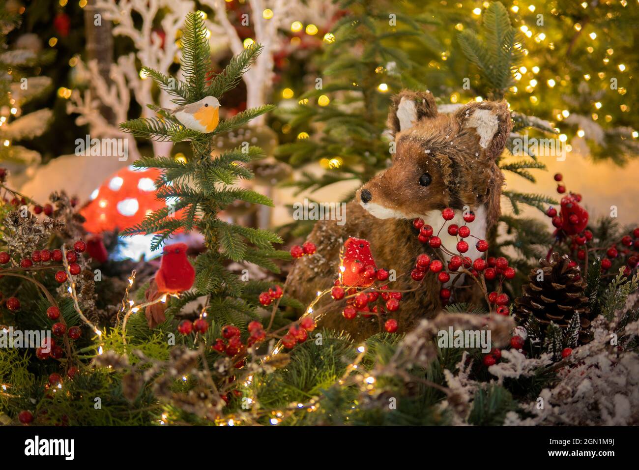 puppet fox sit in a fairy snowy forest. Christmas installation Stock ...