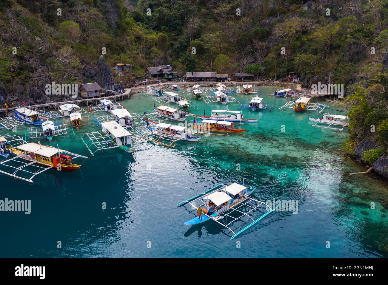 Aerial view of traditional Filipino Banca outrigger canoes lying in the ...