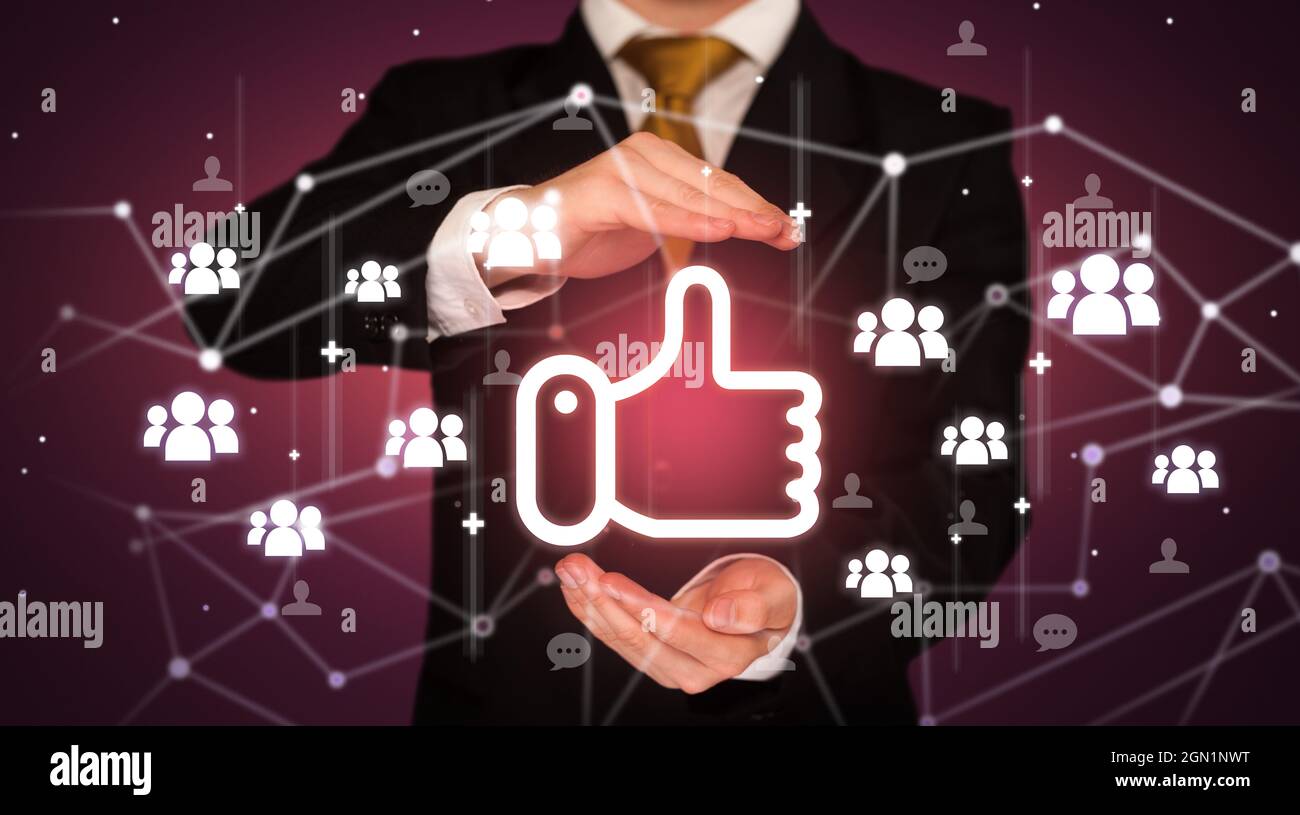 Hand holding social media icons Stock Photo - Alamy