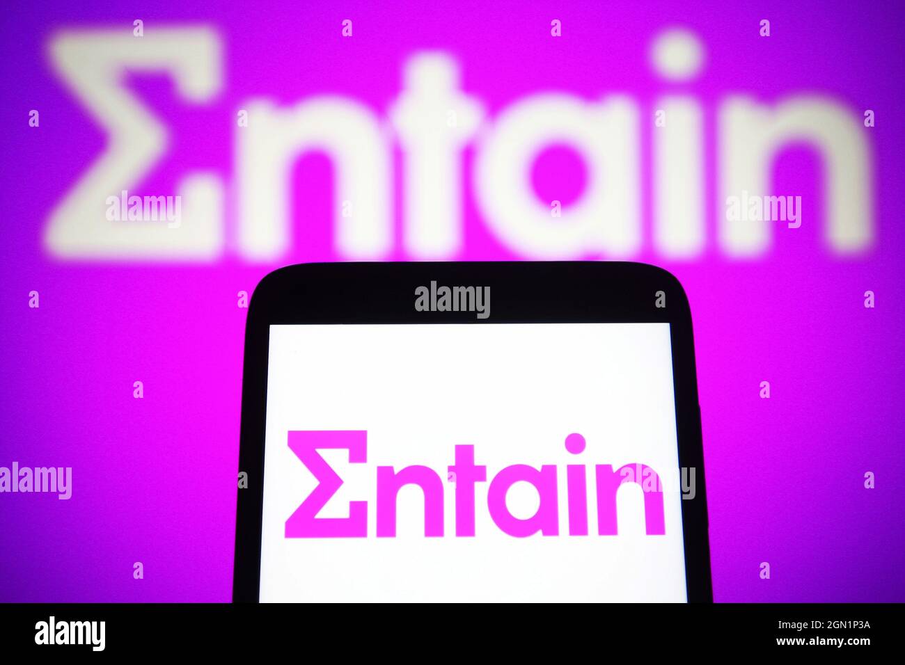 In this photo illustration an Entain plc logo is seen on a smartphone ...
