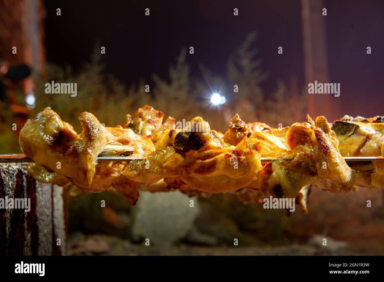chicken meat kebab on barbecue place ready to eat at night Stock Photo ...
