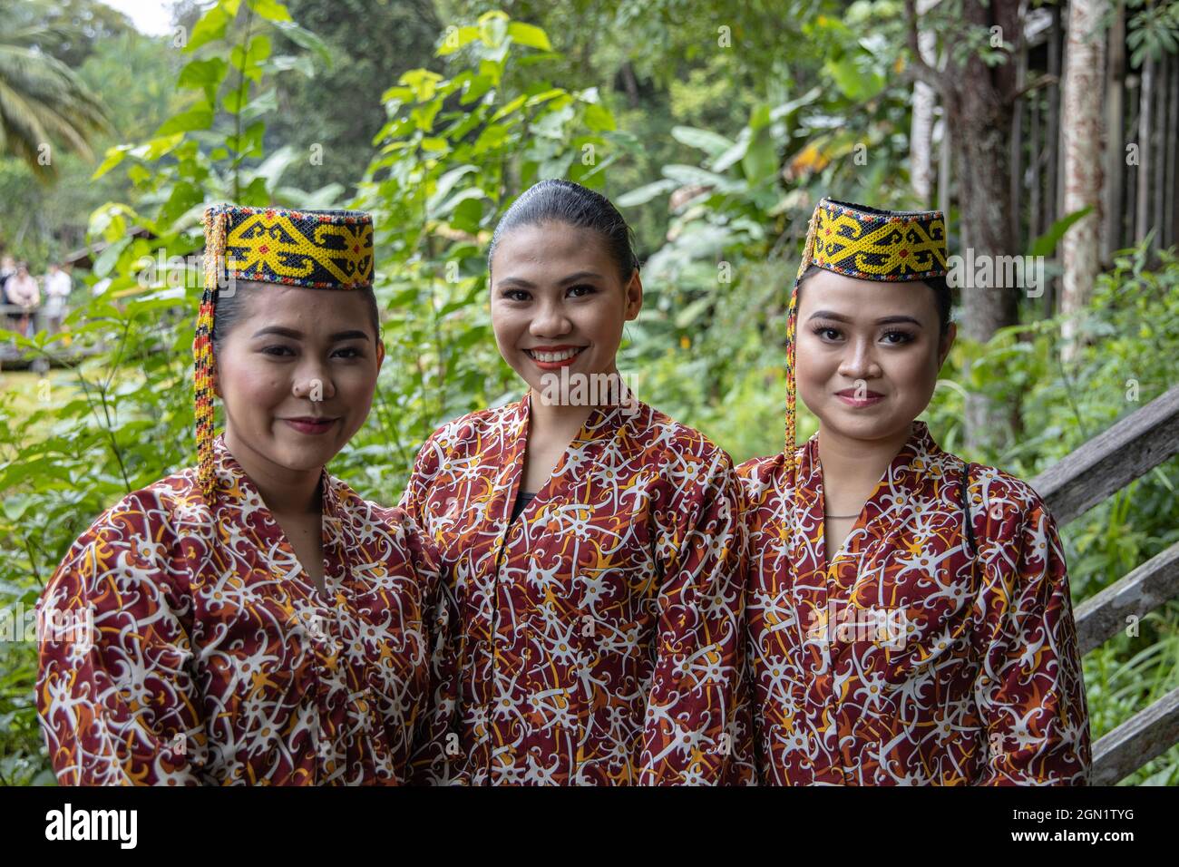 Three friendly women in traditional costume in the Sarawak Cultural ...