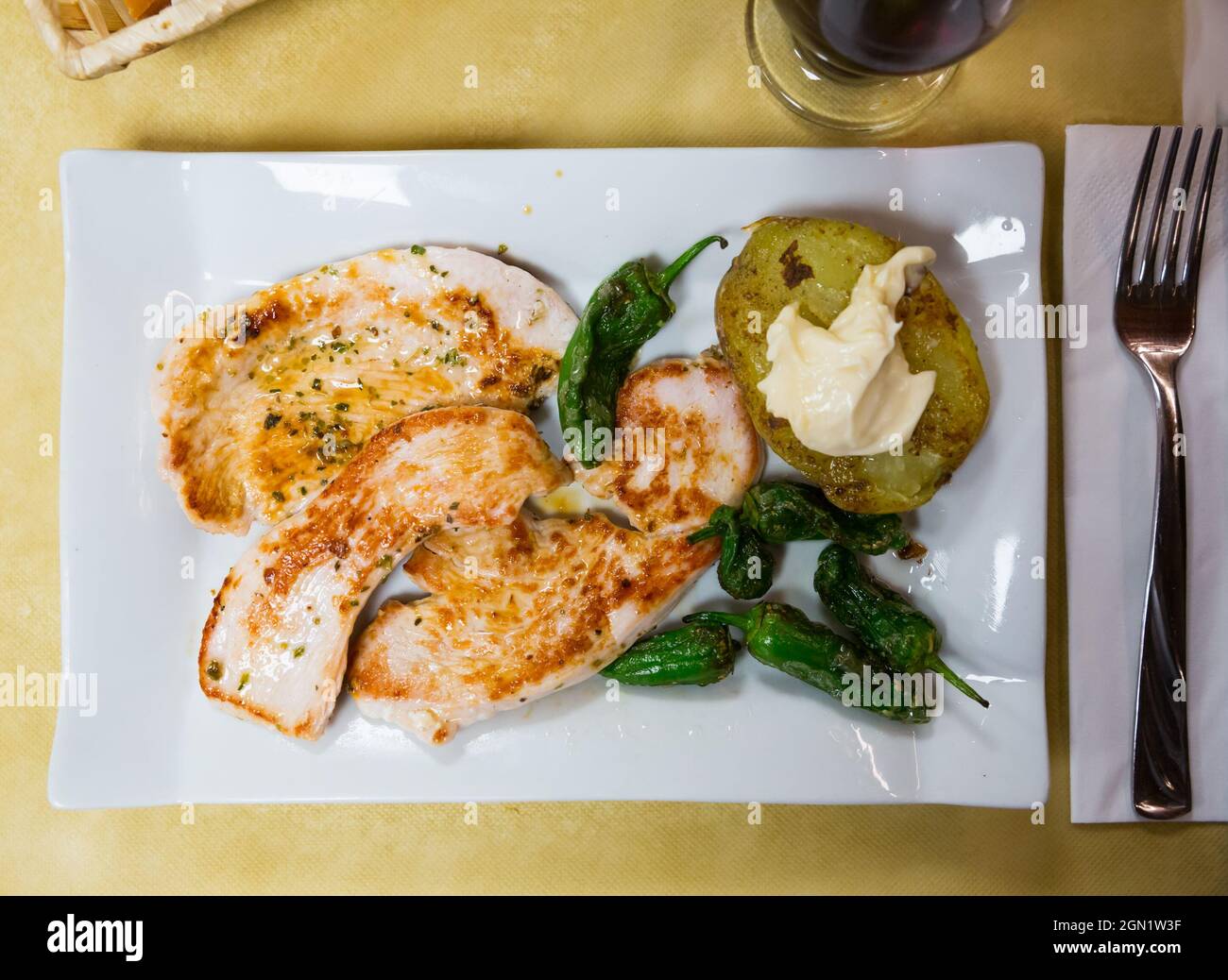 Dish of Spanish cuisine is chicken with sauce ali oli Stock Photo - Alamy