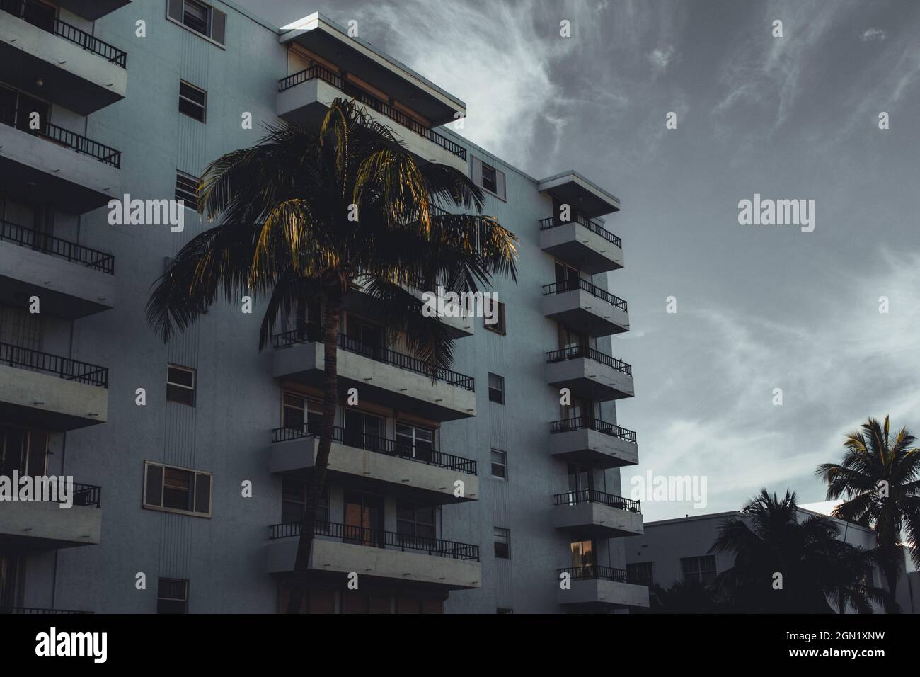Residential building in a tropical town on a cloudy day Stock Photo - Alamy