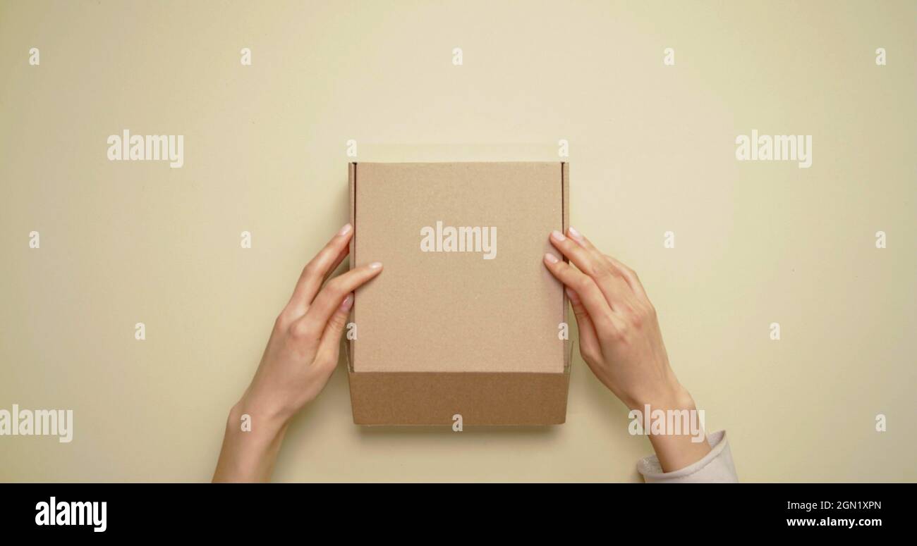 Human hands opening box hi-res stock photography and images - Alamy