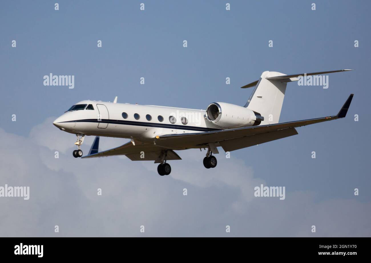 Light private jet comes in for a landing Stock Photo - Alamy