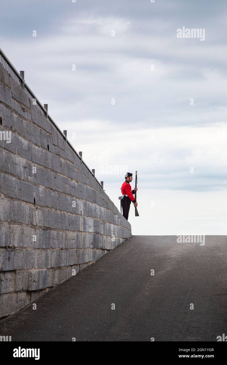 Uniformed performers known as the Fort Henry Guard lead British ...