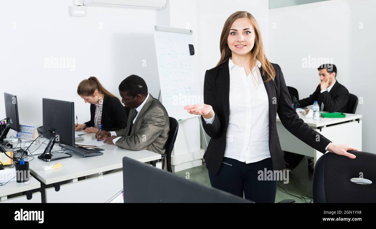 Business woman politely welcoming hi-res stock photography and images ...