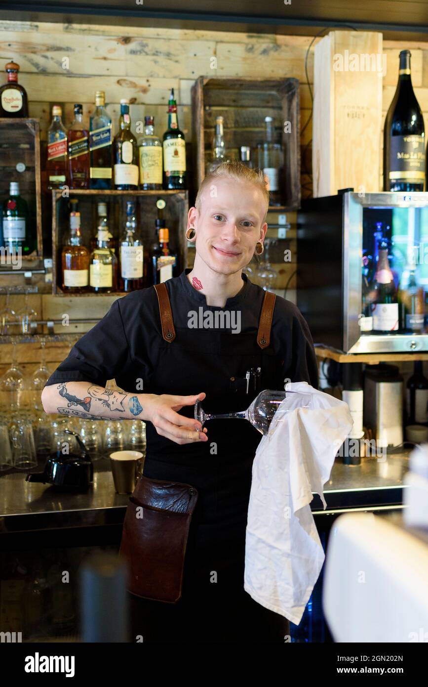 Pub restaurant Den Gode Nabo at the old warehouses on the Nidelva River, Trondheim, Norway Stock ...