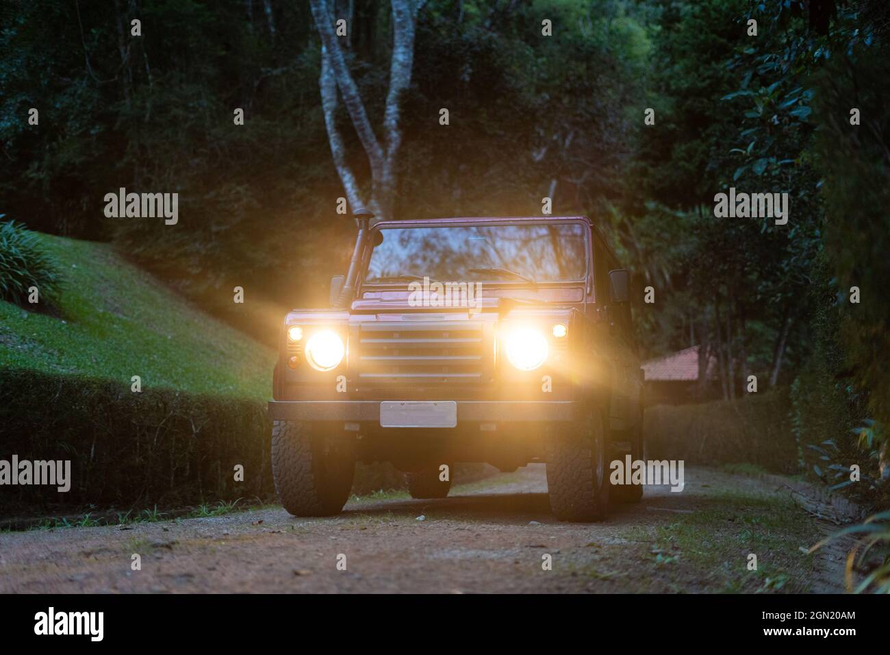 Car driving on the highway with headlights on Stock Photo - Alamy