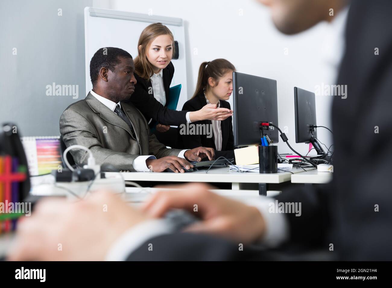 Man manager helping woman hi-res stock photography and images - Alamy