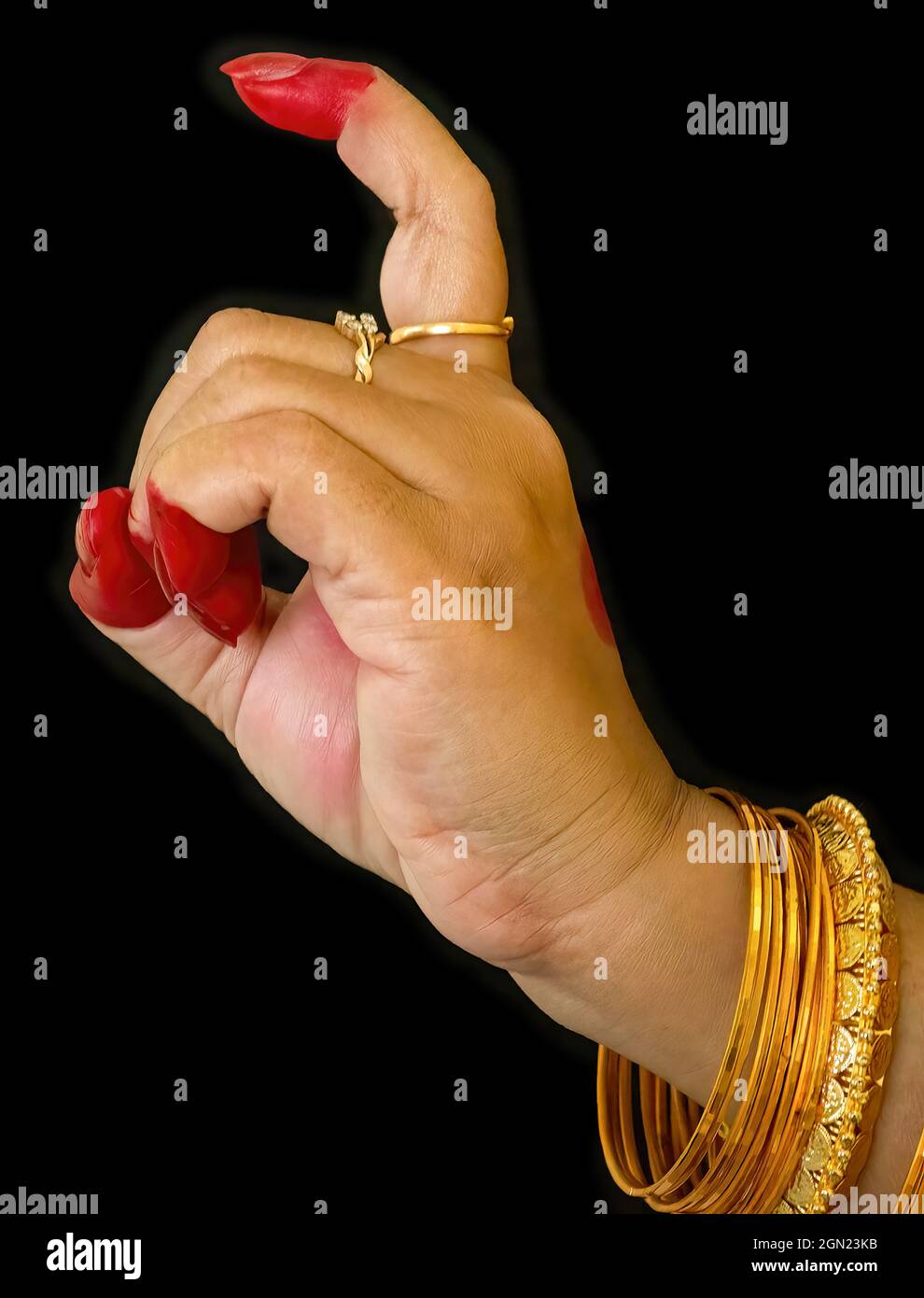 Woman hand demonstrating the "Tamrachua hasta" depicting a Cock or a birds head in Indian ...