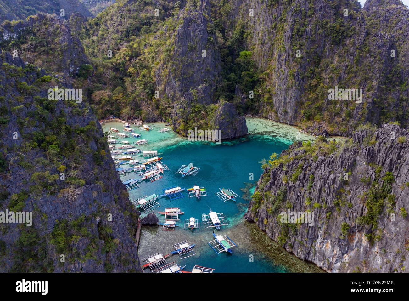 Aerial view of traditional Filipino Banca outrigger canoes lying in the ...