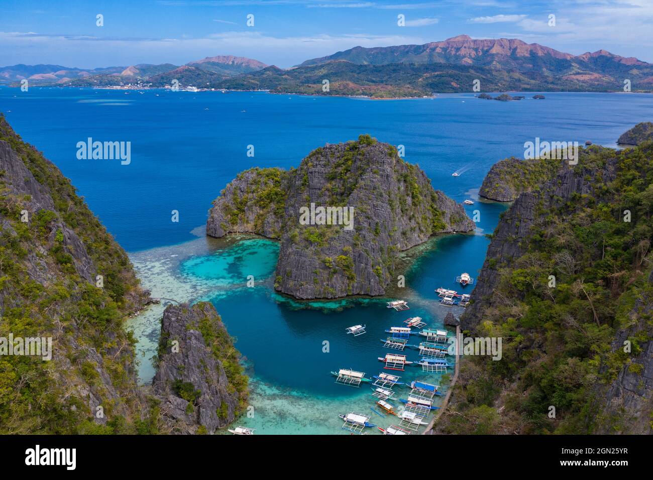 Aerial view of traditional Filipino Banca outrigger canoes lying in the ...