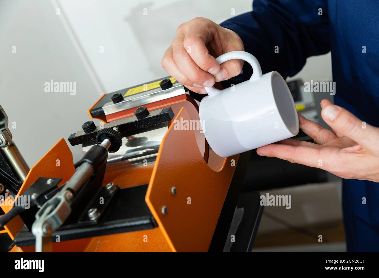 Machine for screen ceramic mug Stock Photo - Alamy