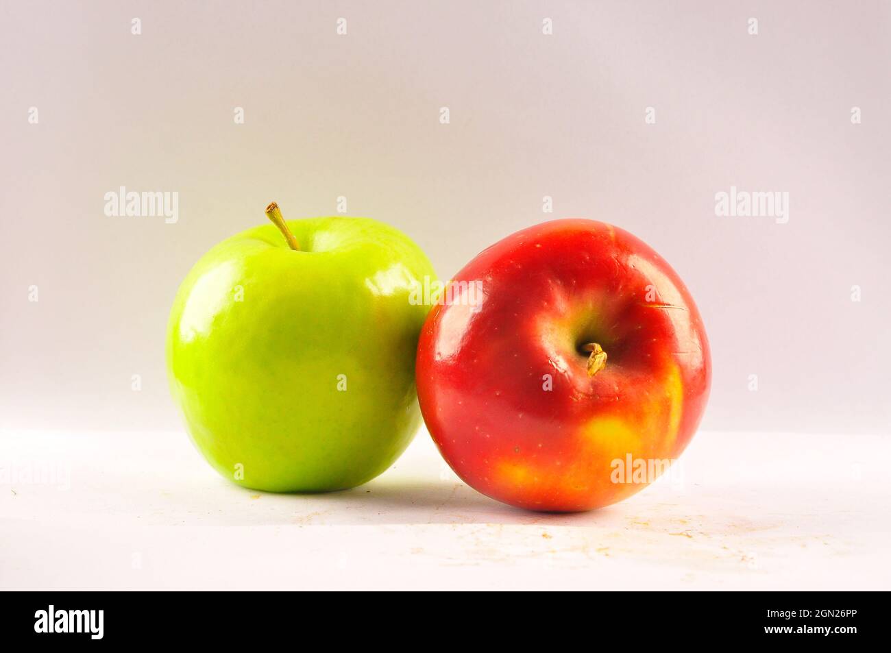 Red and green apple on the table Stock Photo - Alamy