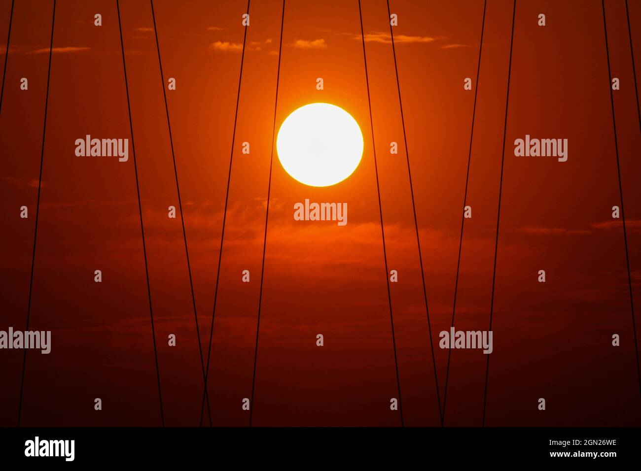 Full moon on red sky at night view through strings Stock Photo - Alamy