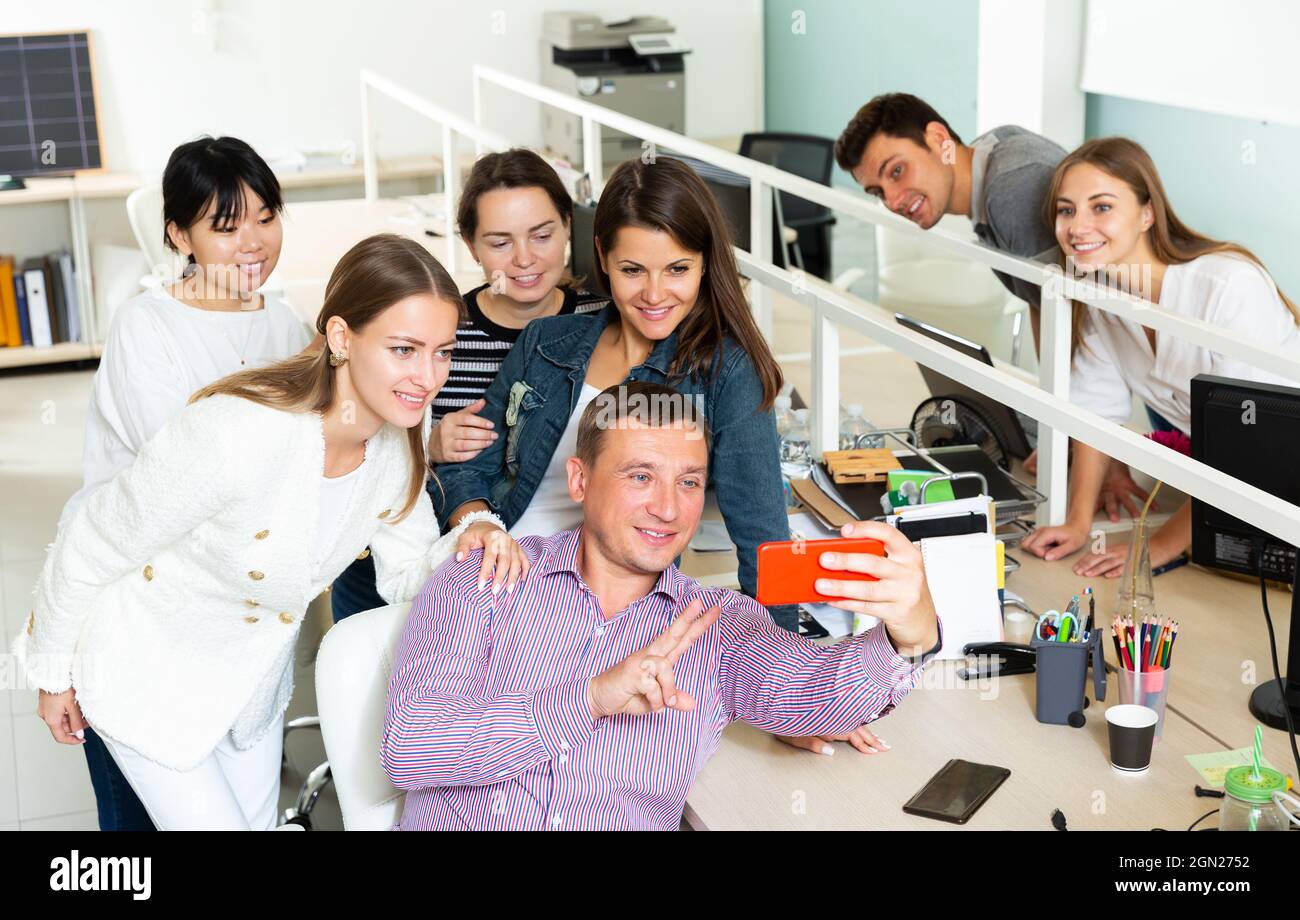Group portrait of male and female managers Stock Photo - Alamy