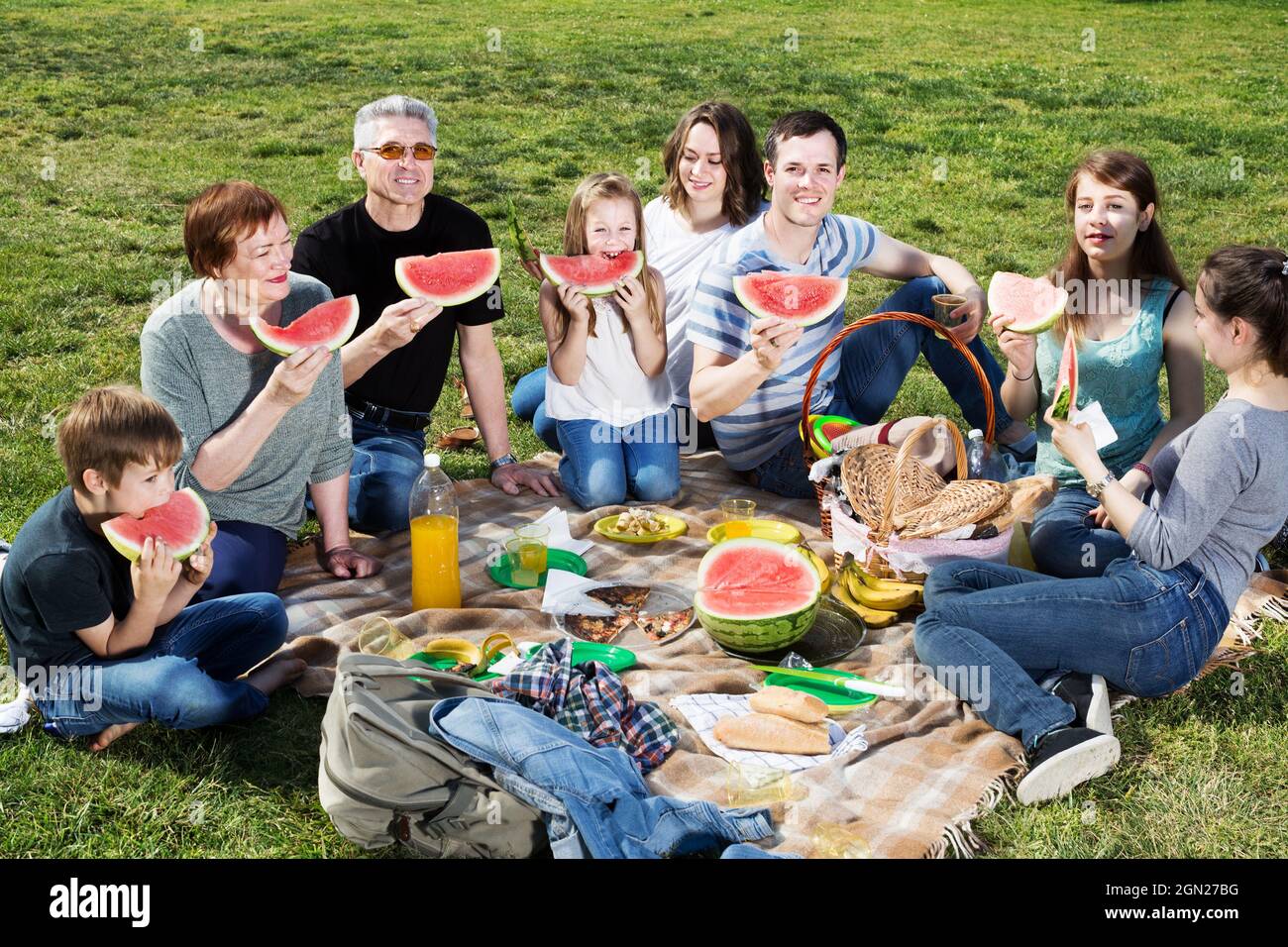 Laughing family sitting and talking on picnic Stock Photo - Alamy
